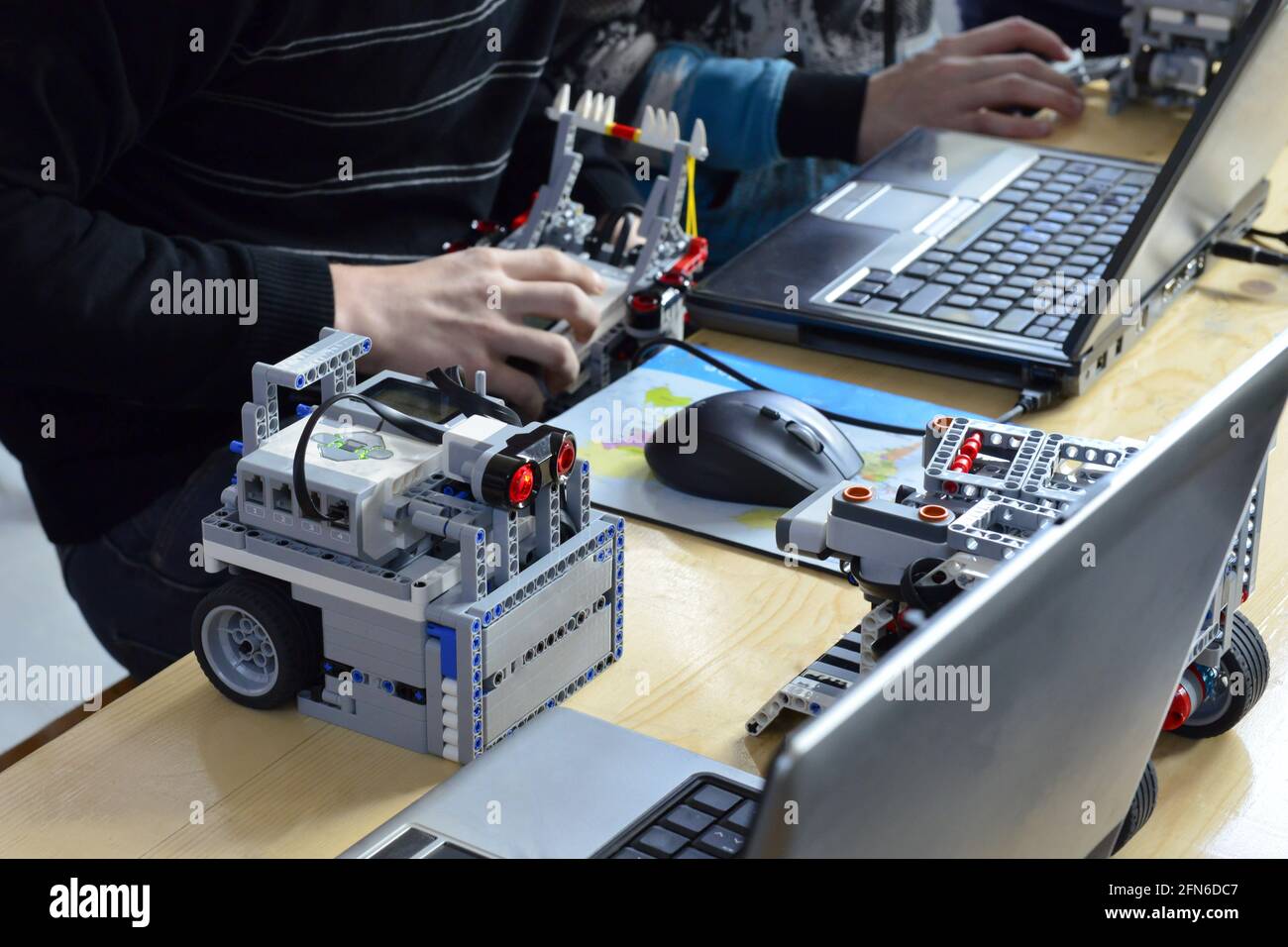 Stem education. Children building robots in classroom Stock Photo - Alamy