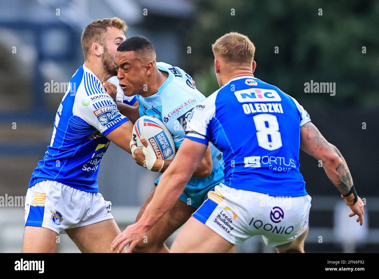 Reece Lyne (4) of Wakefield Trinity looks for away through the Leeds ...