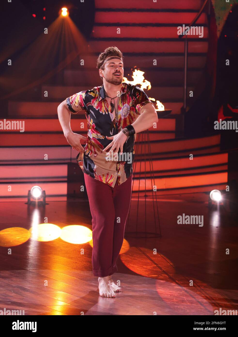 Cologne, Germany. 14th May, 2021. TV actor Nicolas Puschmann dances on ...