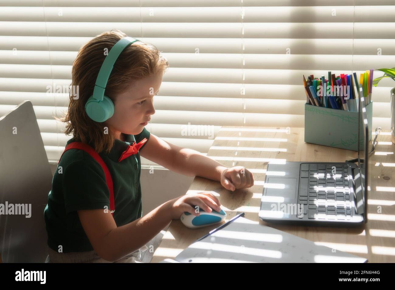School kid using headphone classroom hi-res stock photography and ...