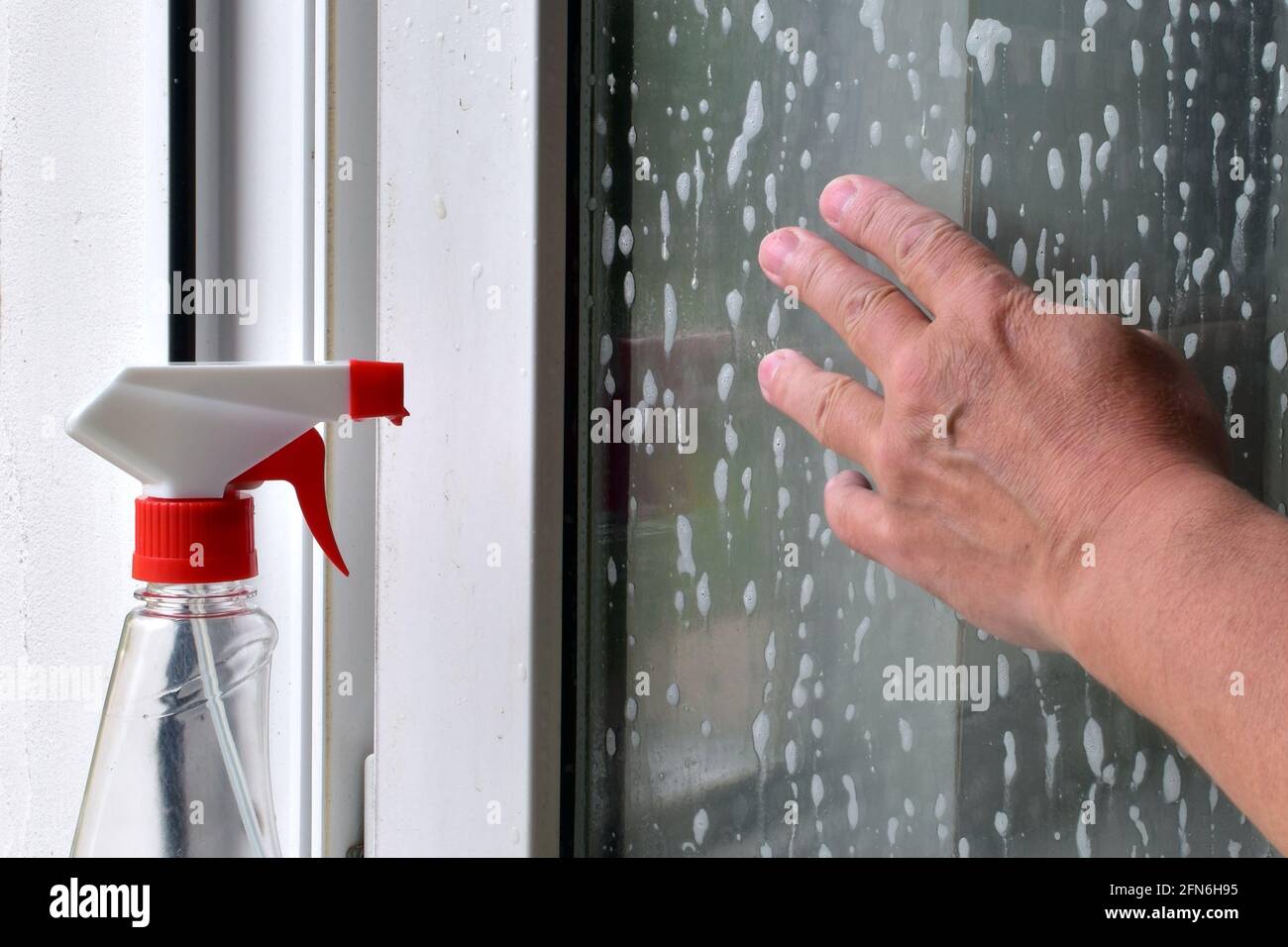 Maid using cloth windows hi-res stock photography and images - Alamy