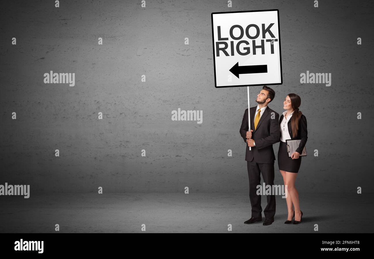 business person holding a traffic sign Stock Photo - Alamy