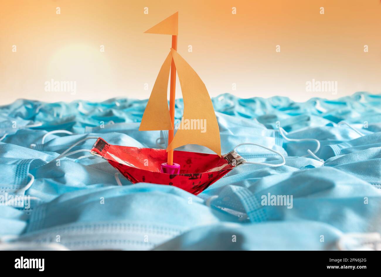 Safety surgical masks arrangement with metaphor of sailing boat on ...