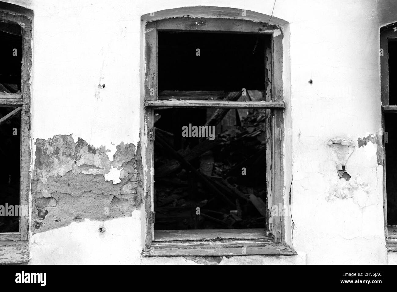 Wall with a window of an old destroyed burnt house Stock Photo - Alamy