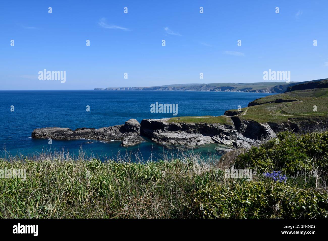 Port Issac looking into Port Gaverne Entrance with Tintagel in the ...