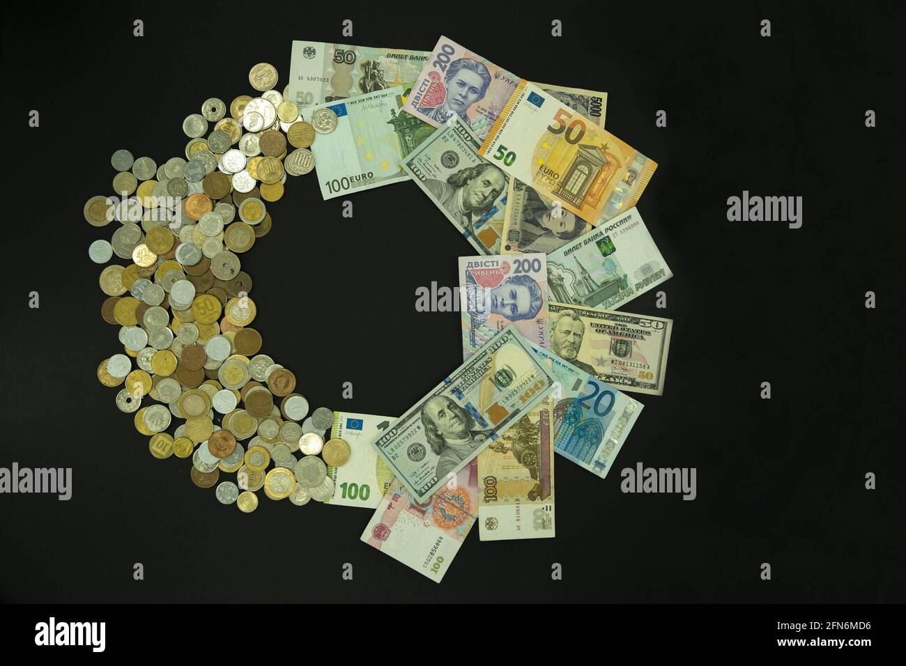World financial crisis. Banknotes and coins of different countries on a ...