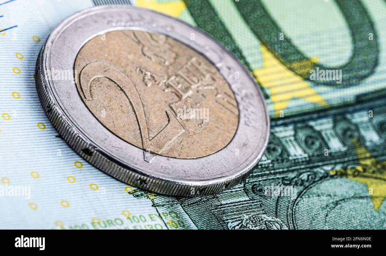 Euro currency one hundred banknote and two euro coin Stock Photo - Alamy