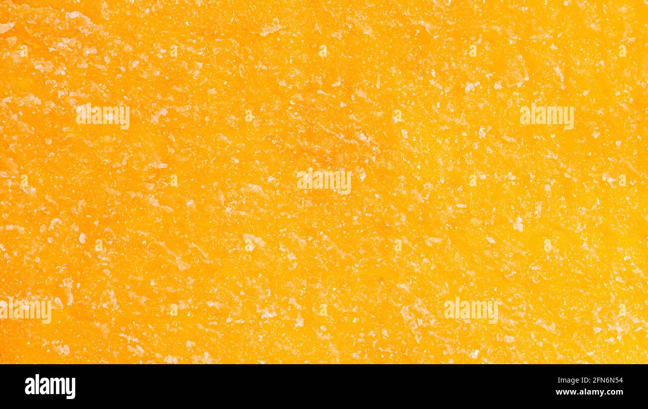 Bright orange texture of mango jerky slice Stock Photo - Alamy