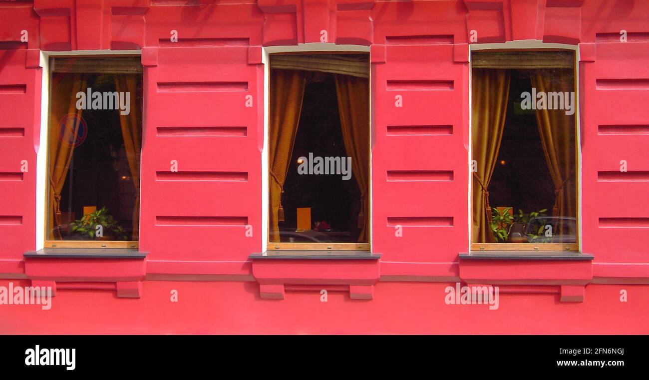 three window of restaurant on red wall Stock Photo - Alamy