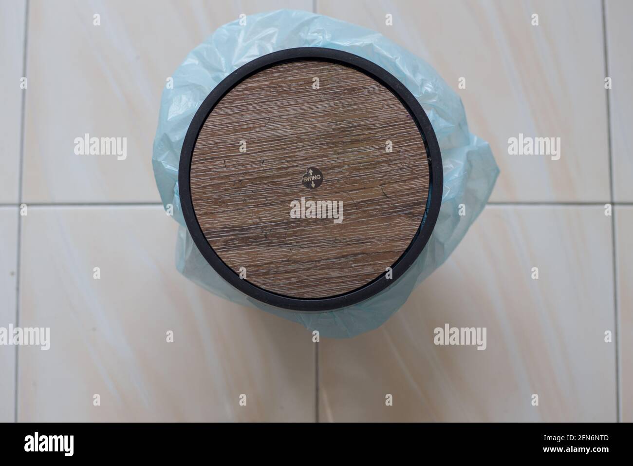 High angle shot of a trash can with a plastic bag Stock Photo - Alamy