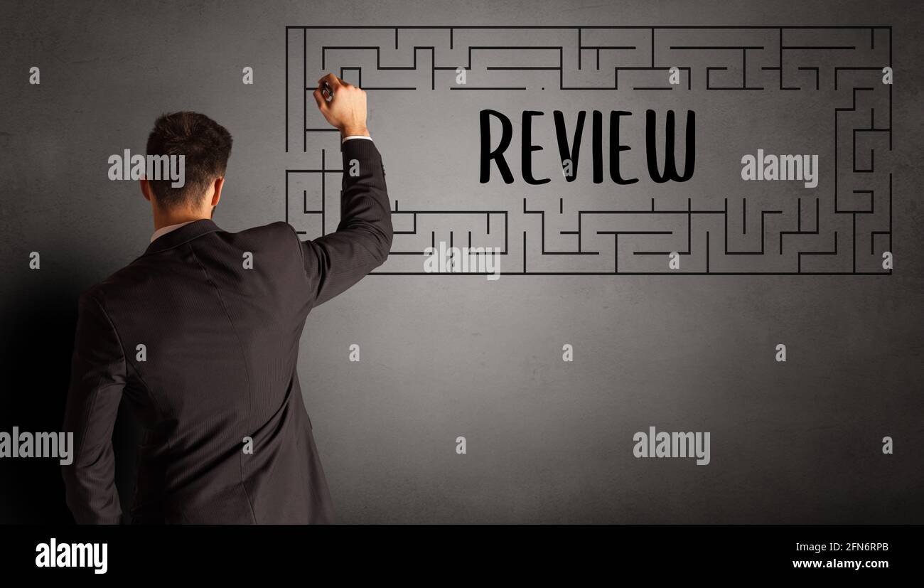 businessman drawing maze concept Stock Photo - Alamy