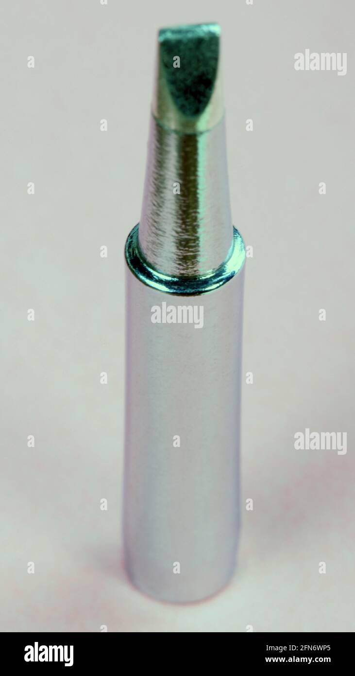 Soldering tips on pink background Stock Photo - Alamy