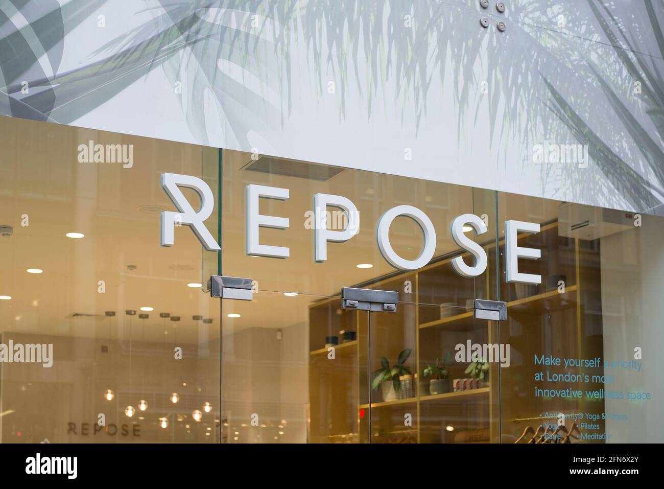 Repose Wellness Logo Shop Sign Stock Photo - Alamy