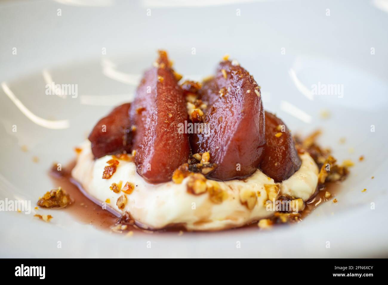 dessert with pears, cream and nuts Stock Photo - Alamy