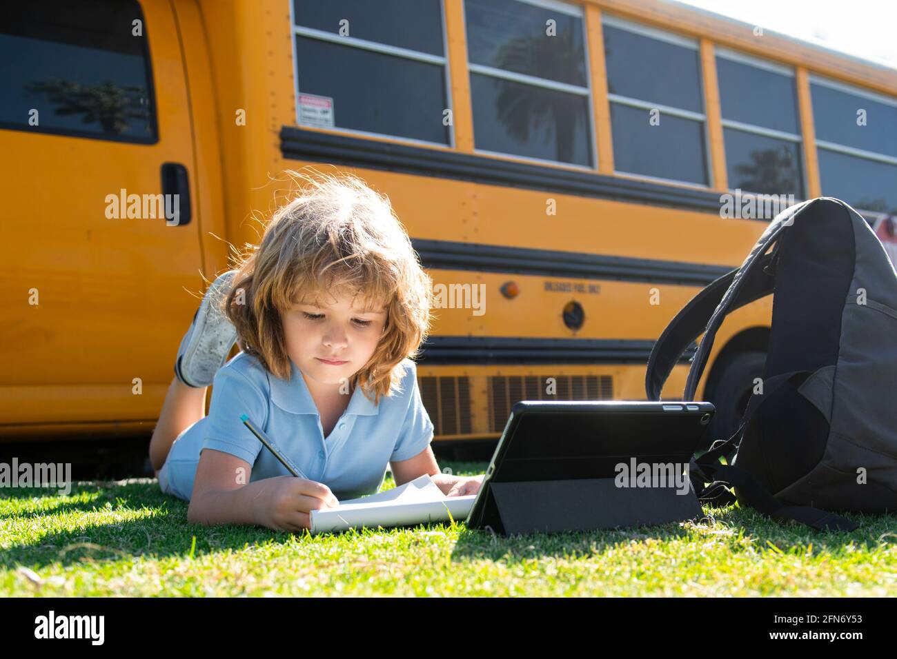 Child on school bus tablet hi-res stock photography and images - Alamy