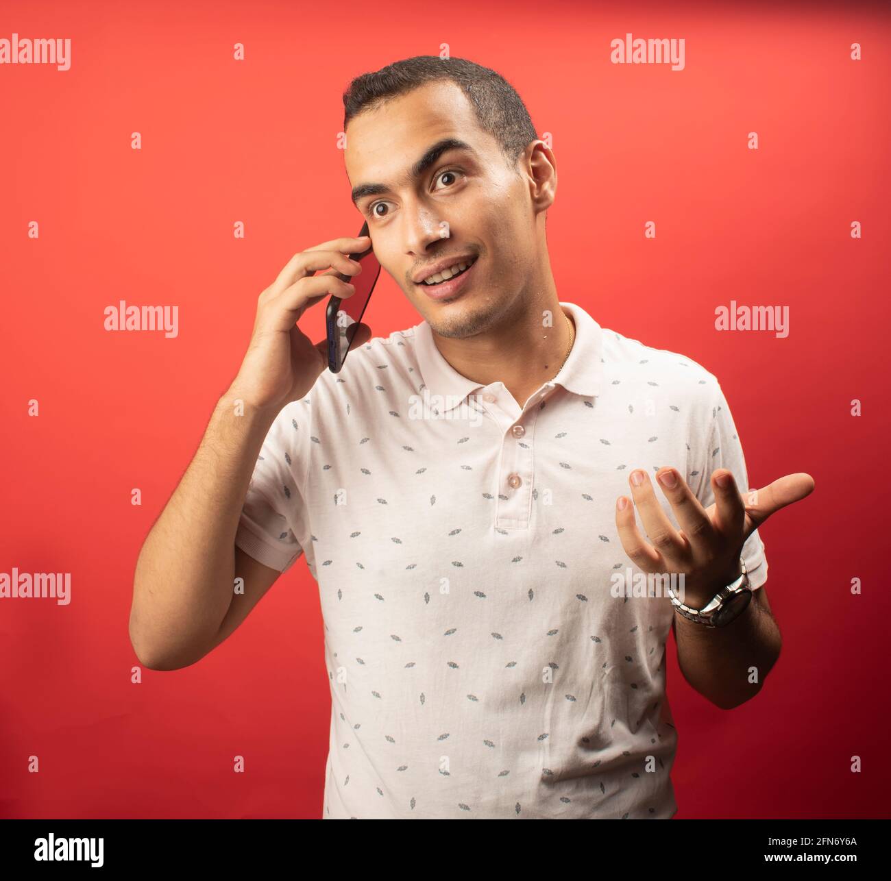 a young man receiving a phone call Stock Photo - Alamy
