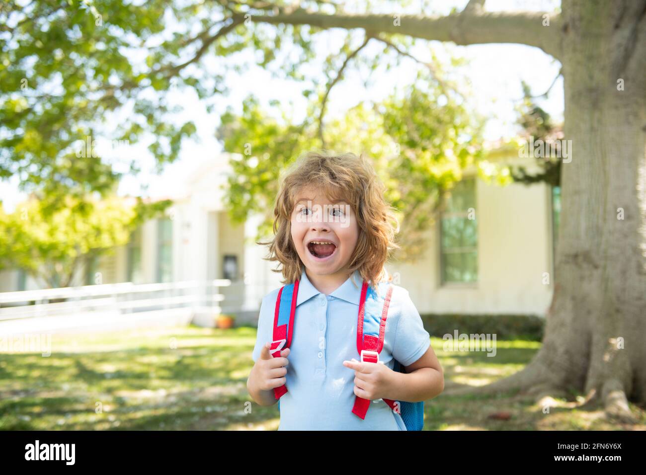 Little student excited to be back to preschool. Knowledge day. Kid go ...