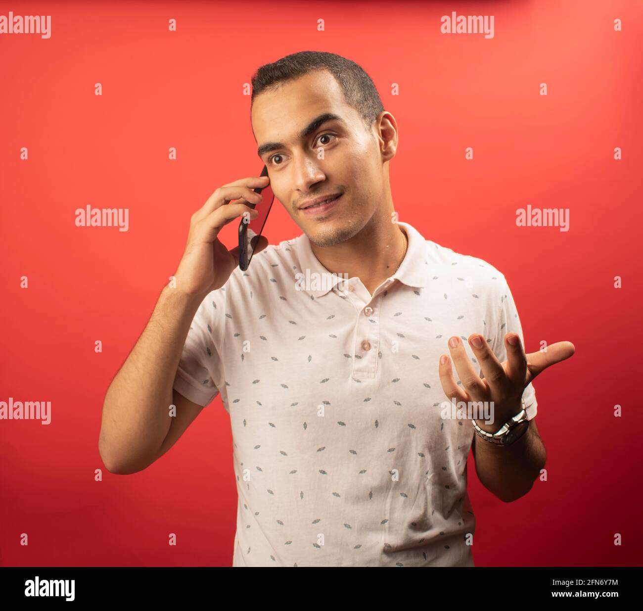 a young man receiving a phone call Stock Photo - Alamy