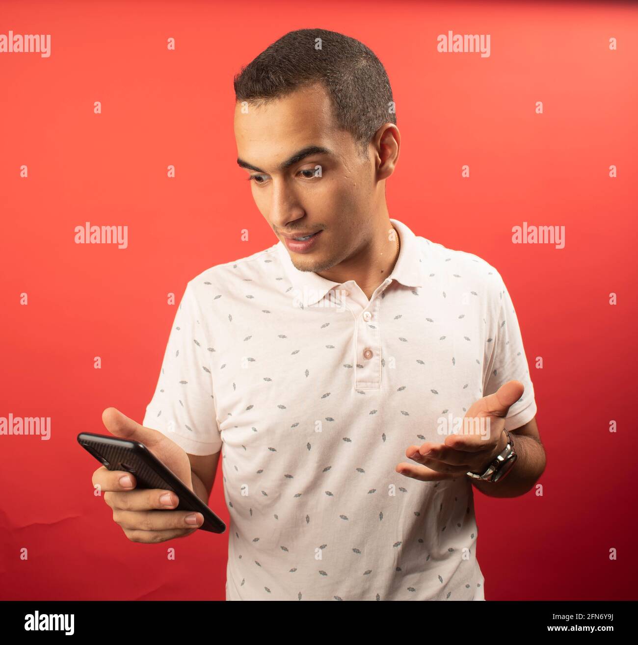 a man looking into his phone Stock Photo - Alamy