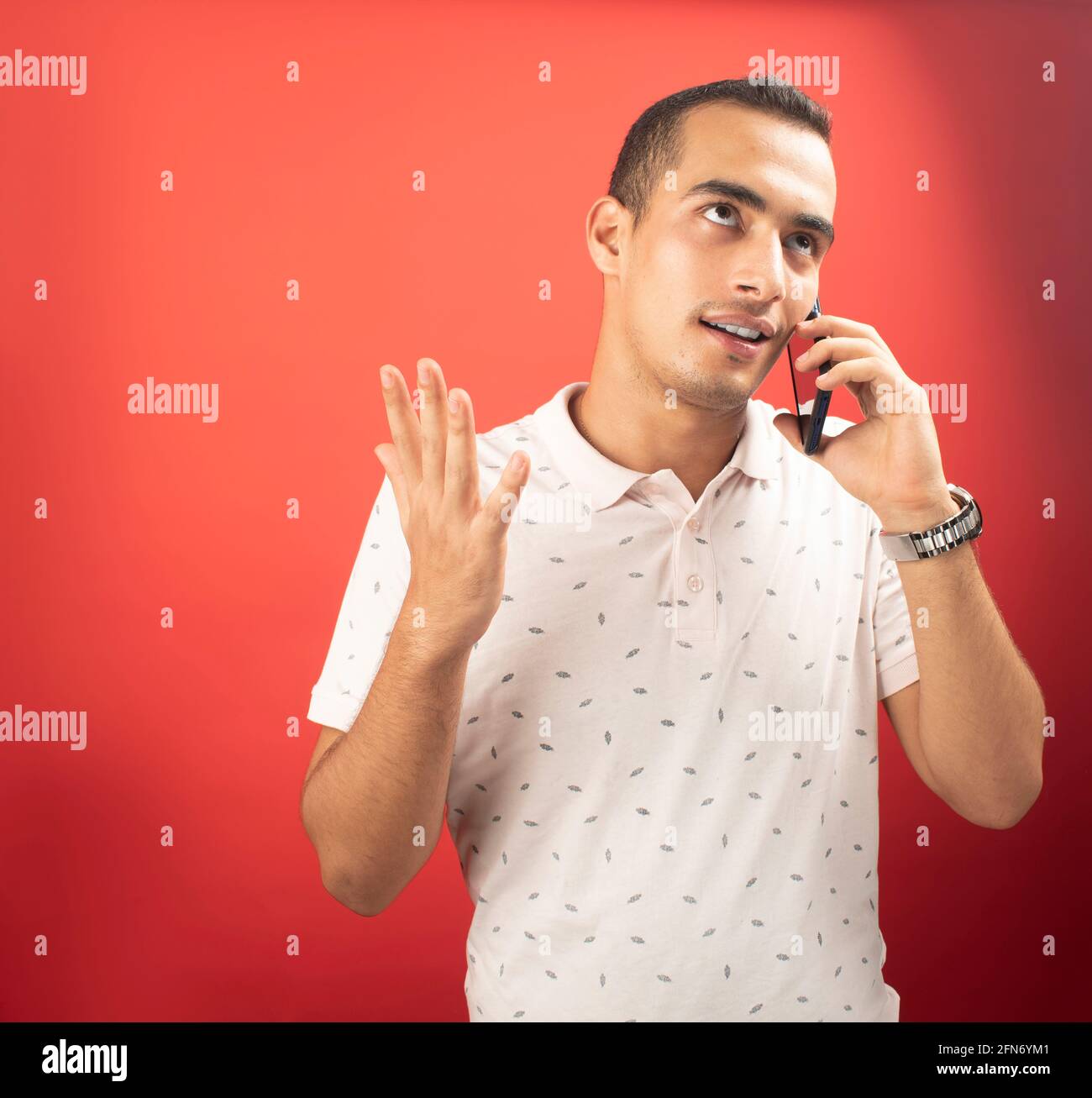 a young man making a phone call Stock Photo - Alamy