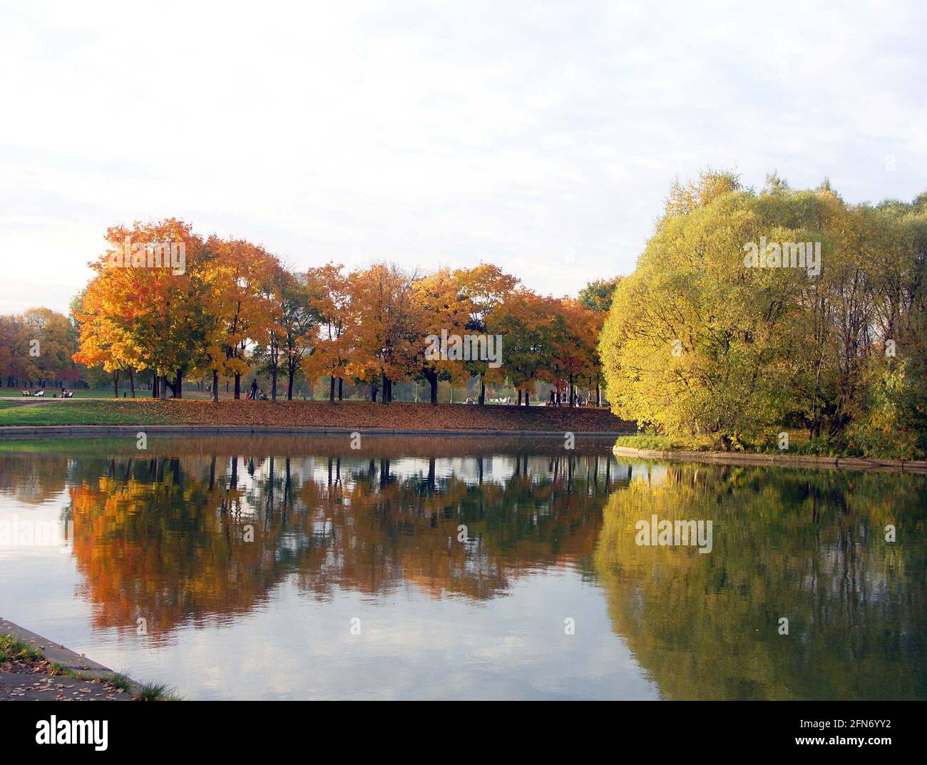 autumn in city park at evening Stock Photo - Alamy