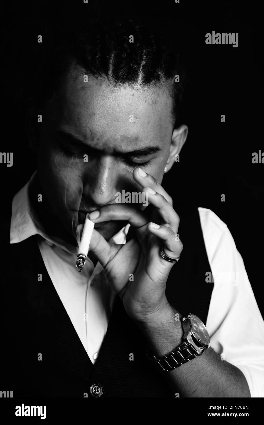 Cool and handsome mob smoking cigarette in grayscale Stock Photo - Alamy