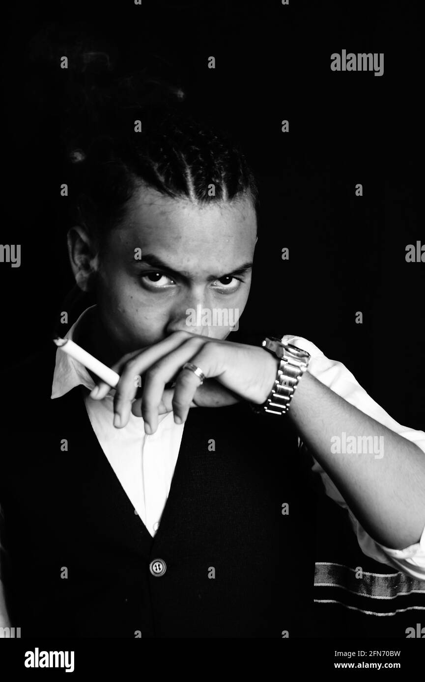 Cool and handsome mob smoking cigarette in grayscale Stock Photo - Alamy
