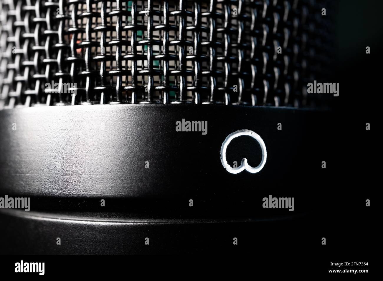 Macro closeup of isolated large diaphragm condenser microphone body ...