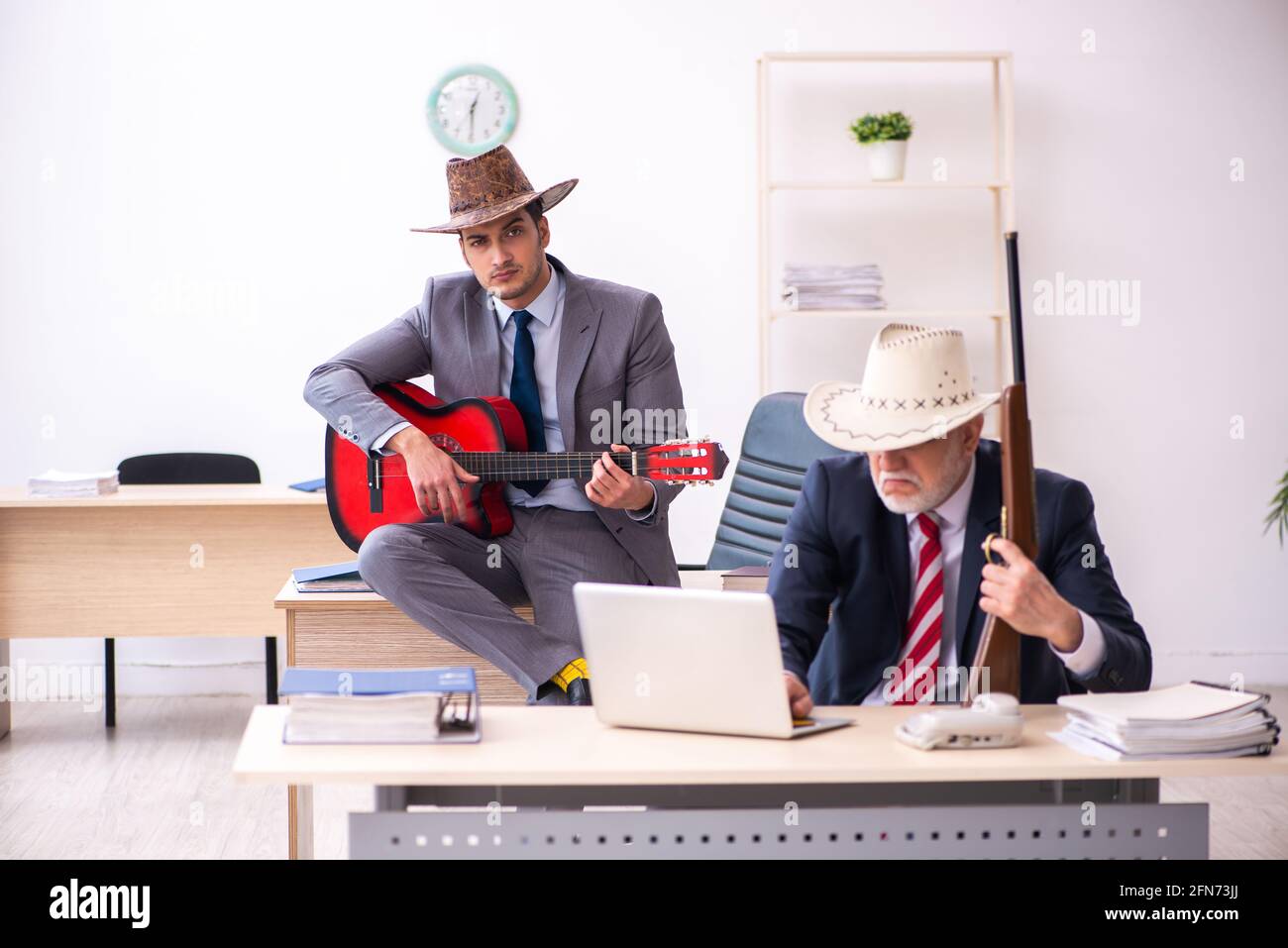 Two cowboy employees in hi-res stock photography and images - Alamy