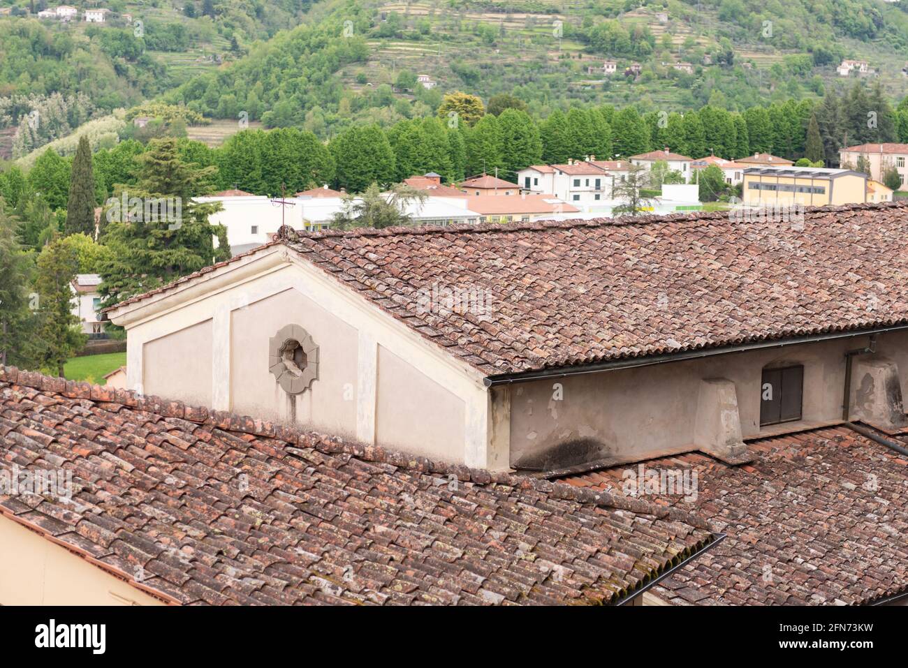 Old tiled roof. Beautiful roofs in the medieval town of Barga in ...