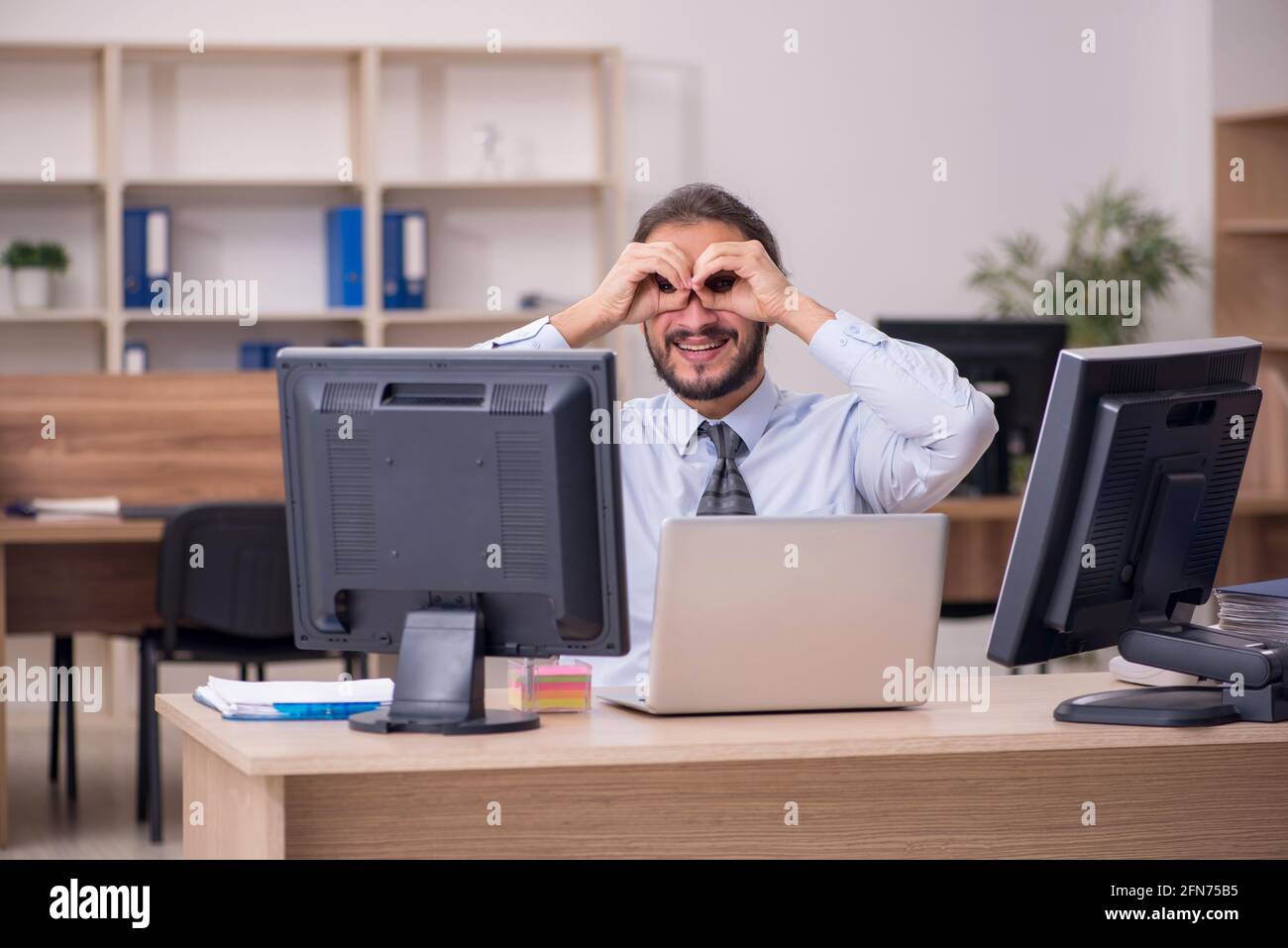 Multitasking young businessman inside office hi-res stock photography ...