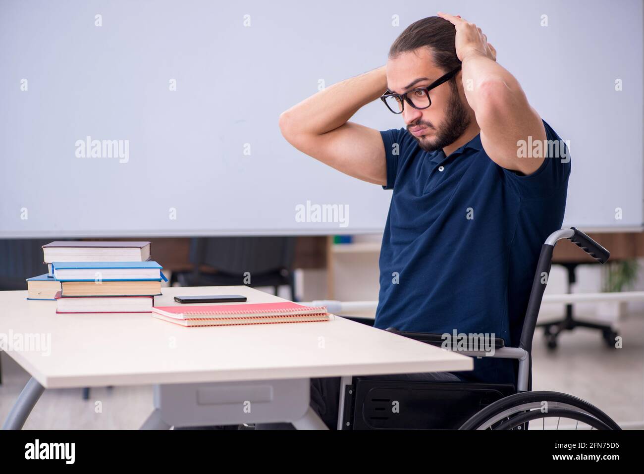 Young handicapped student in the classroom Stock Photo - Alamy