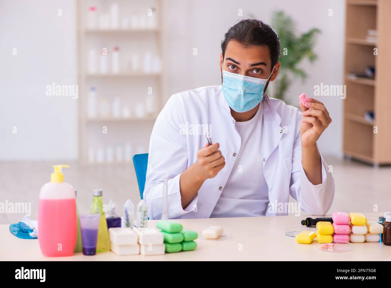 Young chemist testing soap in the lab Stock Photo - Alamy