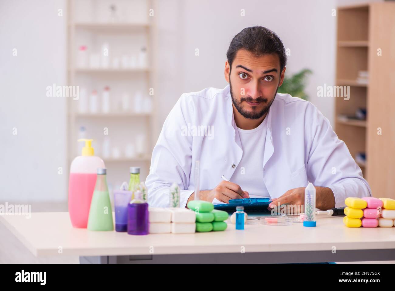 Young chemist testing soap in the lab Stock Photo - Alamy