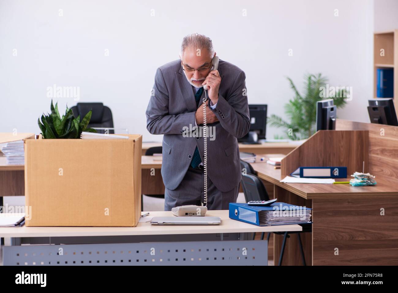 Old employee being fired from his work Stock Photo - Alamy