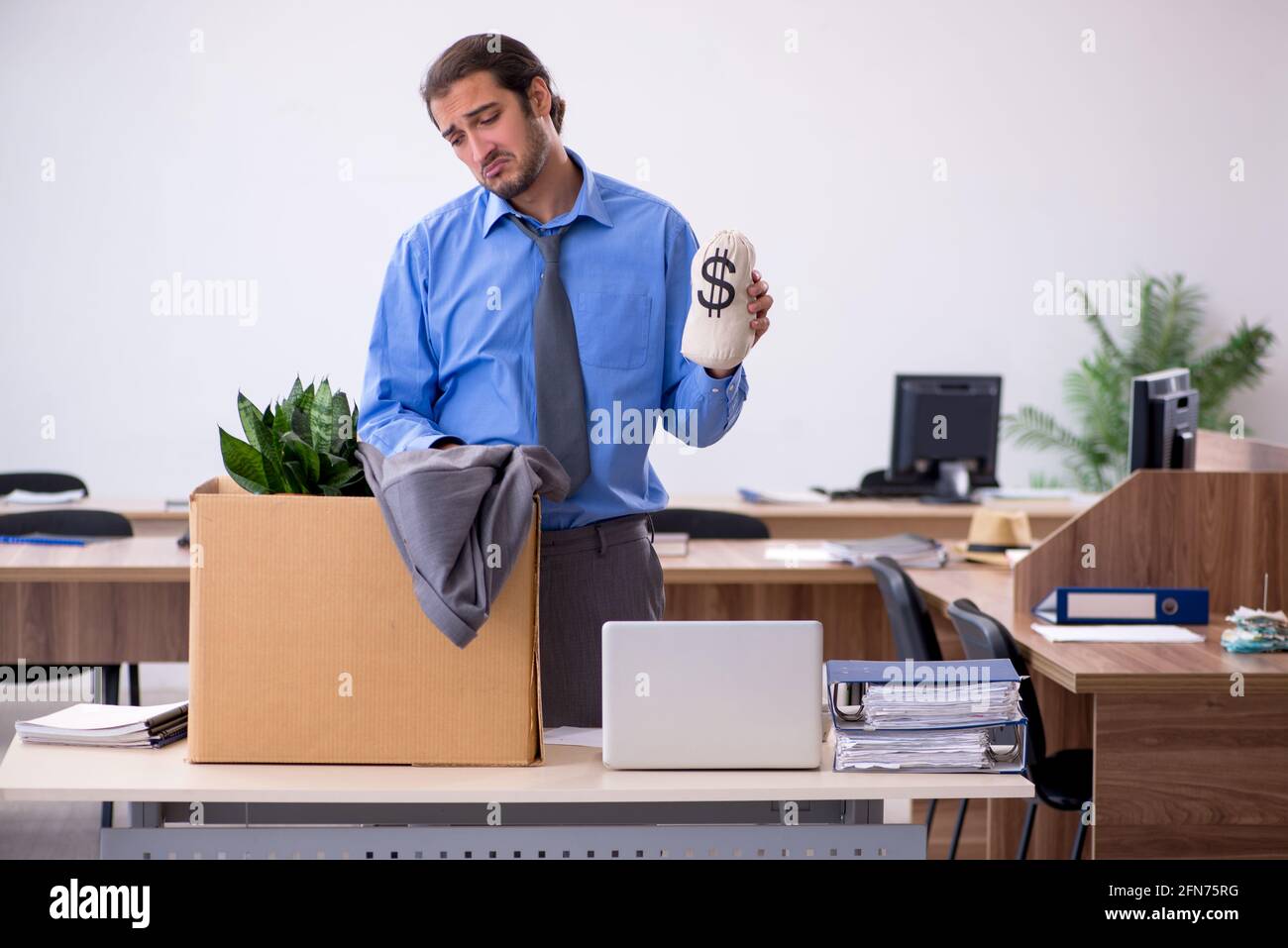 Young employee being fired from his work Stock Photo - Alamy