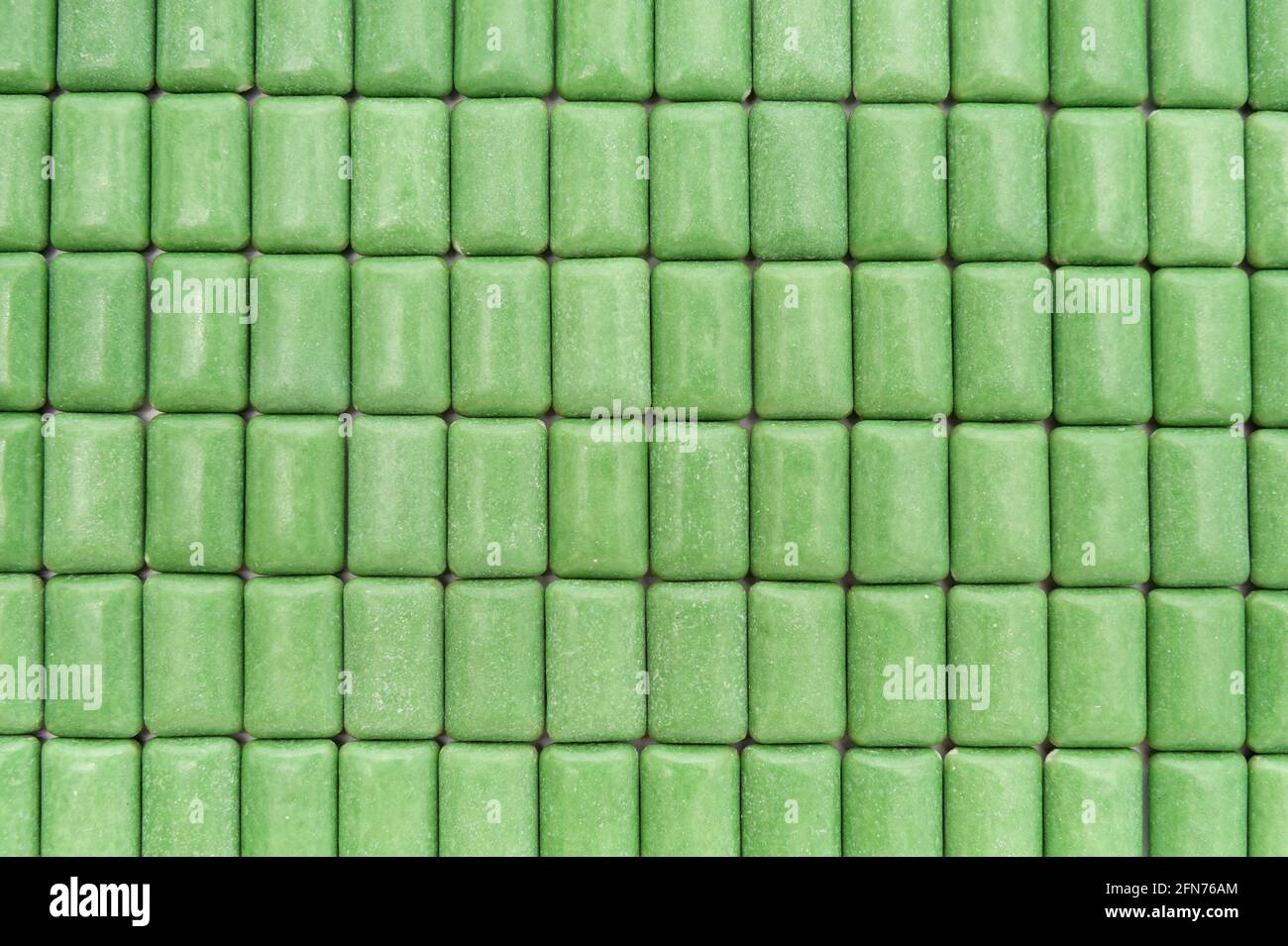 Green mint chewing gum tablets aligned. Top view. Close-up. Horizontal ...