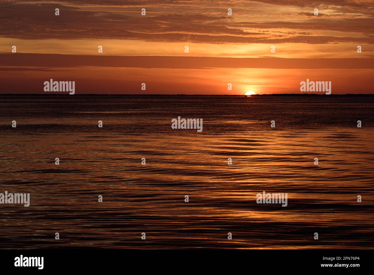 Sunset sun over ocean water. Natural sky colors. Sunrise seascape Stock ...