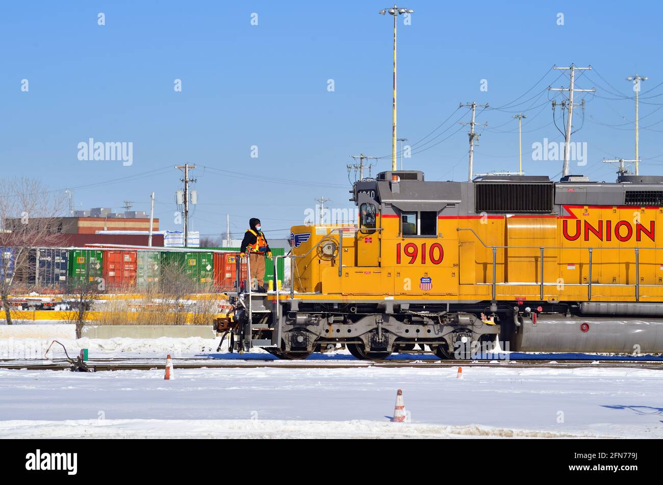 Berkeley, Illinois, USA. Crew member deals with the winter conditions ...