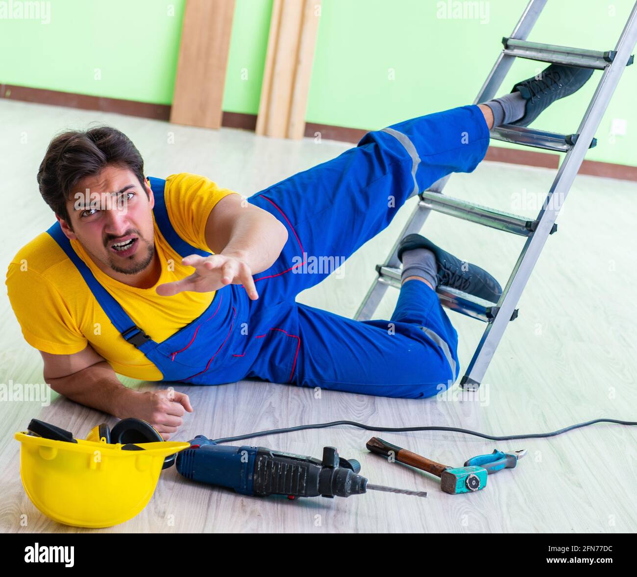 The injured worker at the work site Stock Photo - Alamy