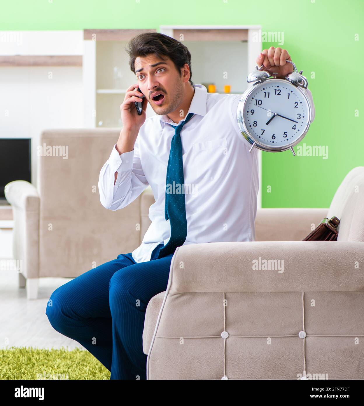 The man dressing up and late for work Stock Photo - Alamy