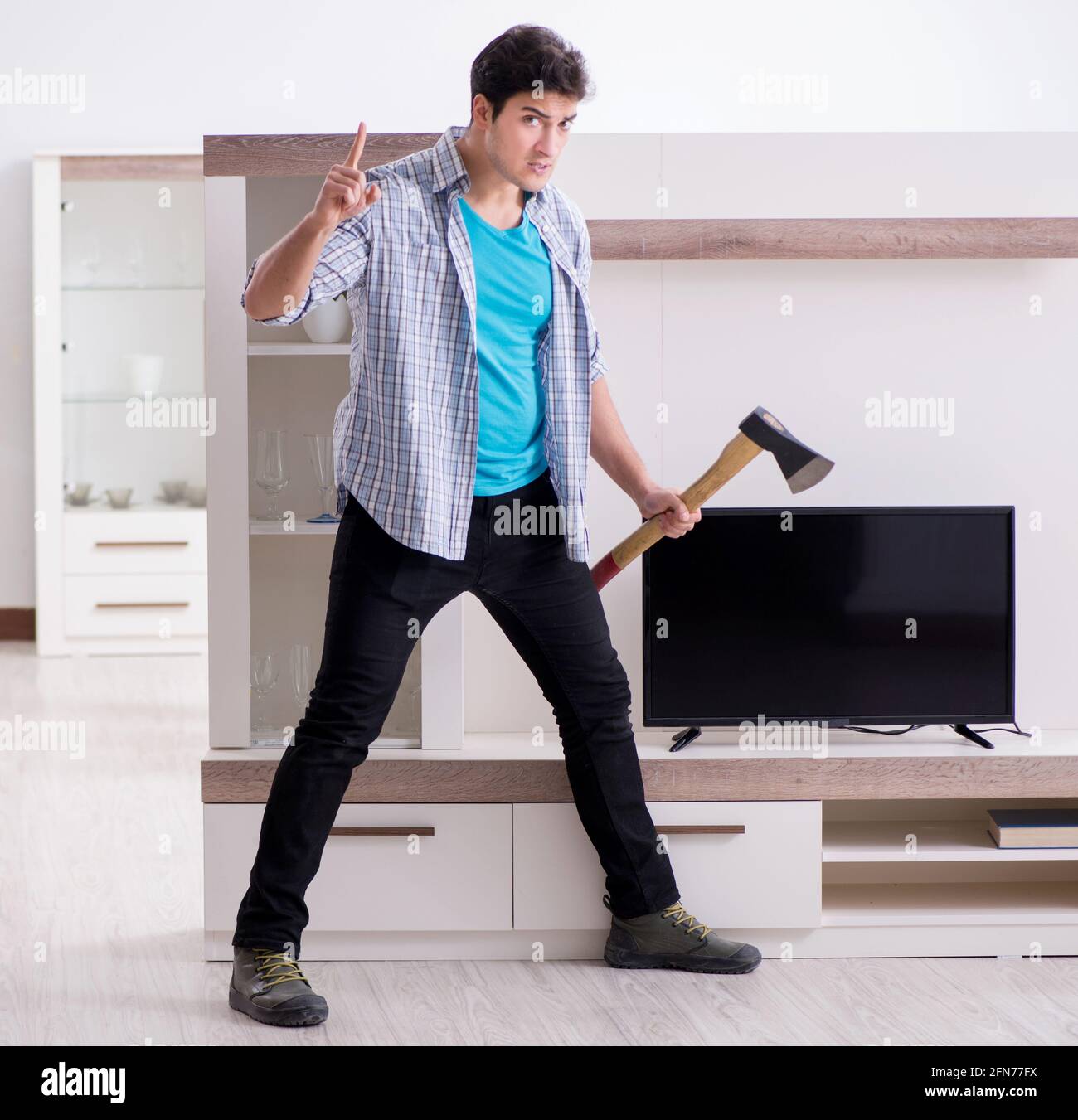 The man trying to fix broken tv Stock Photo - Alamy