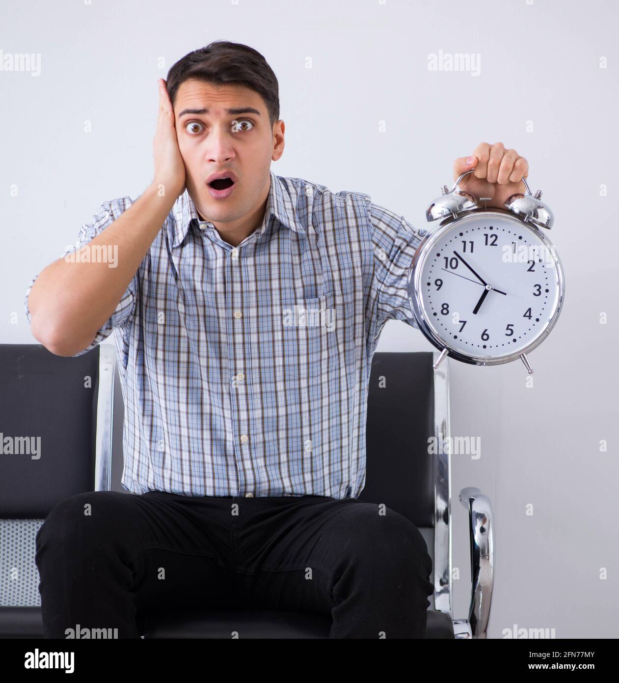 The man nervously impatiently waiting in the lobby Stock Photo - Alamy