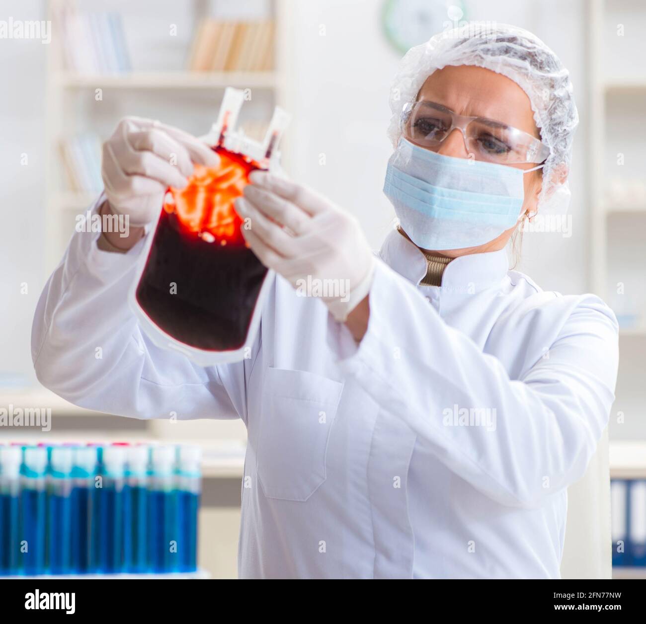The woman doctor checking blood samples in lab Stock Photo - Alamy