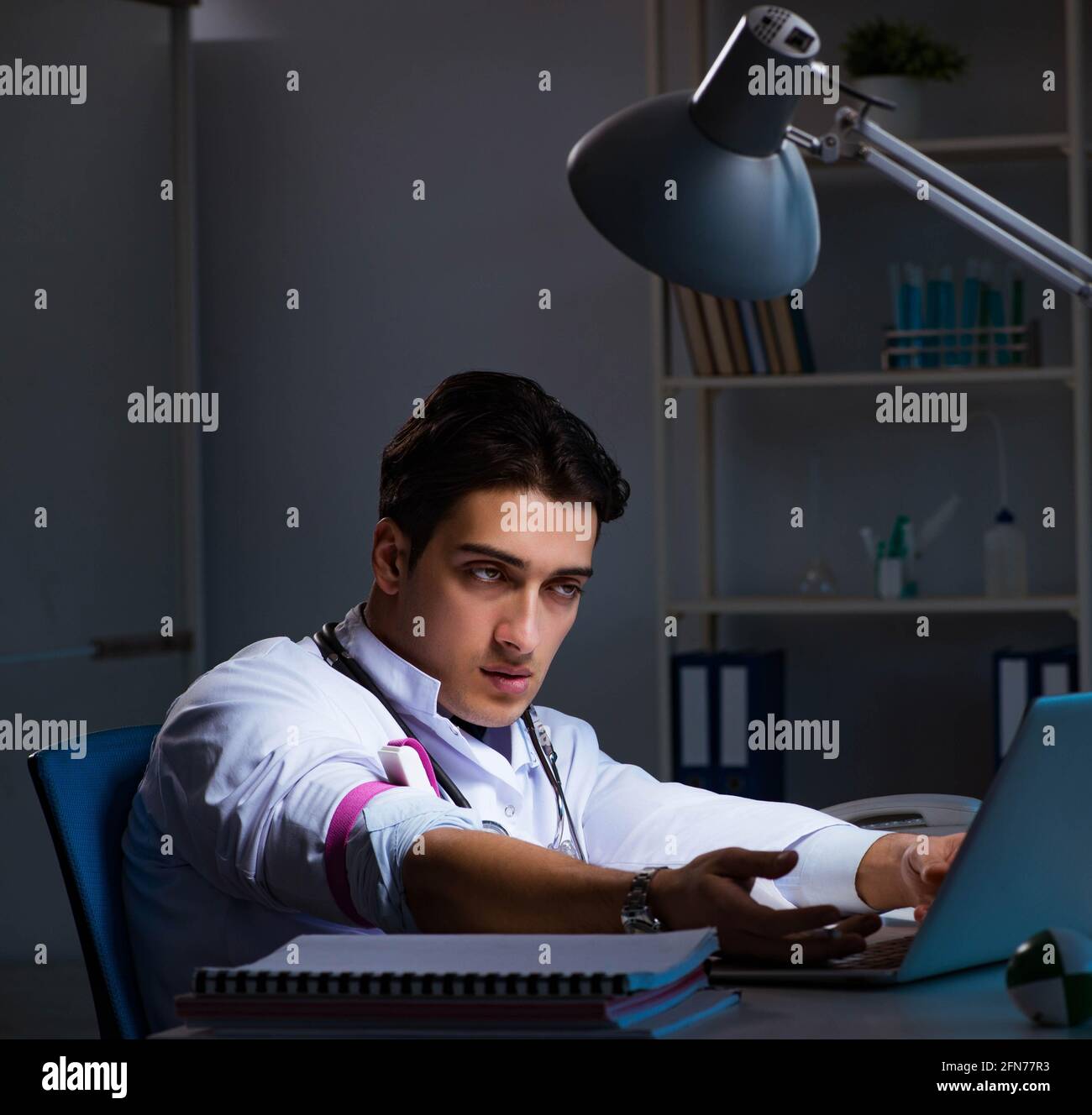 The doctor drug addict staying late on hospital Stock Photo - Alamy