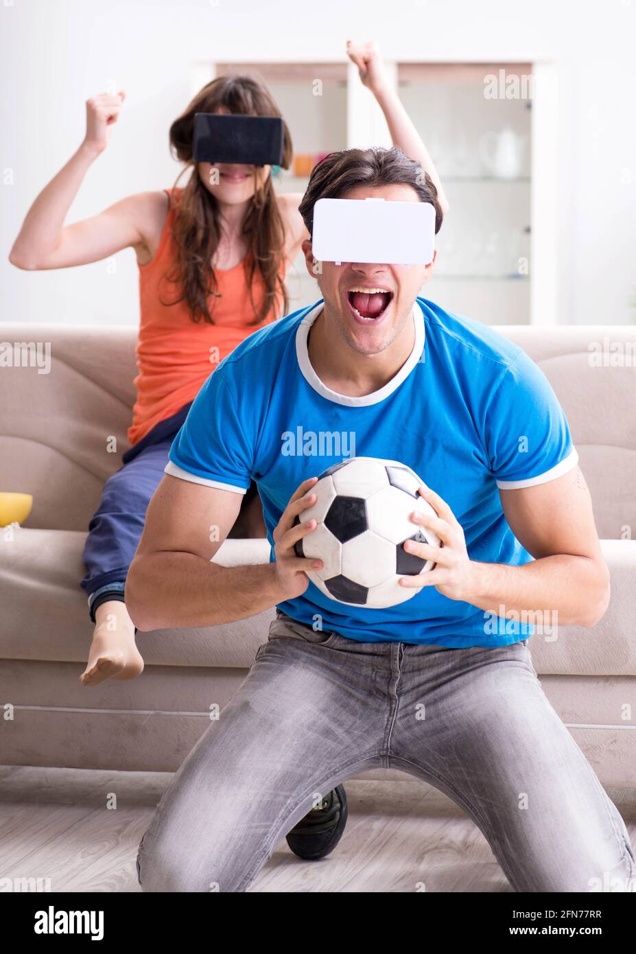 The man watching football on virtual reality vr glasses Stock Photo - Alamy