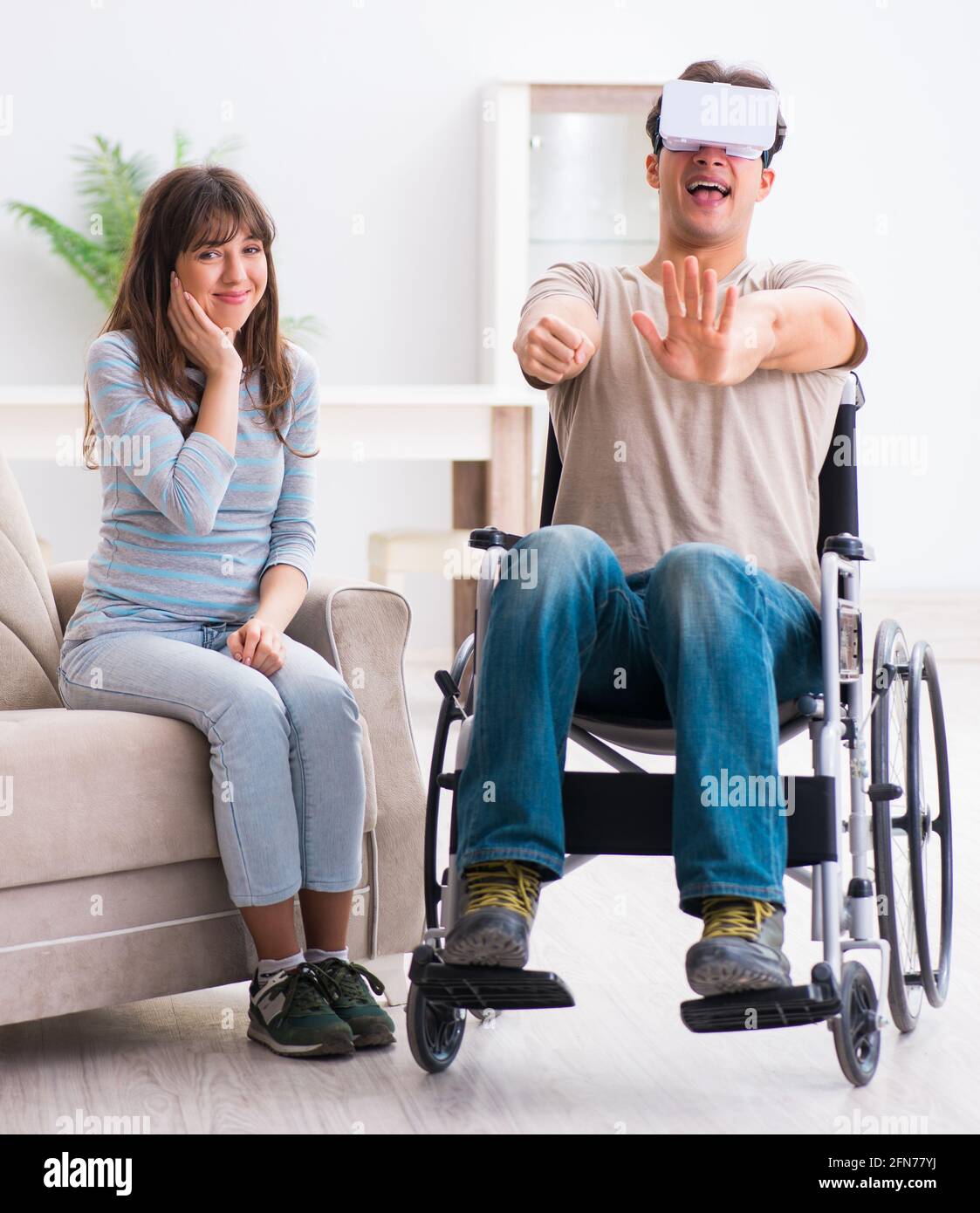 The disabled man with virtual glasses Stock Photo - Alamy