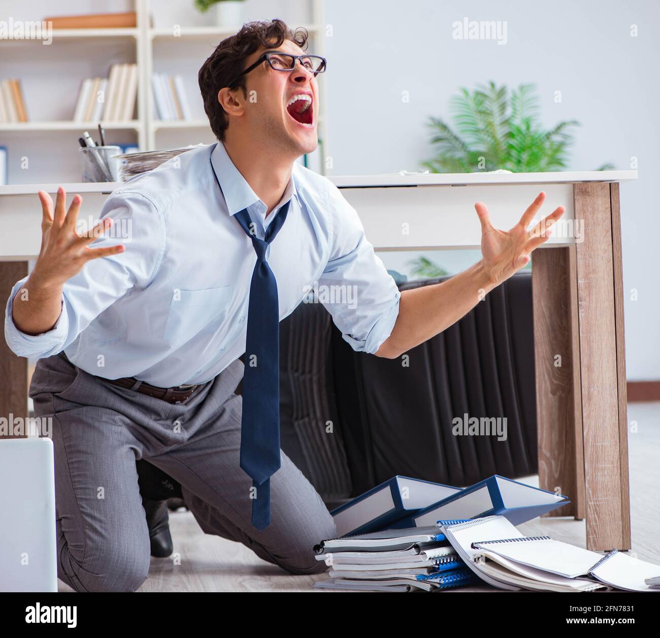 The bankrupt businessman angry in the office floor Stock Photo - Alamy