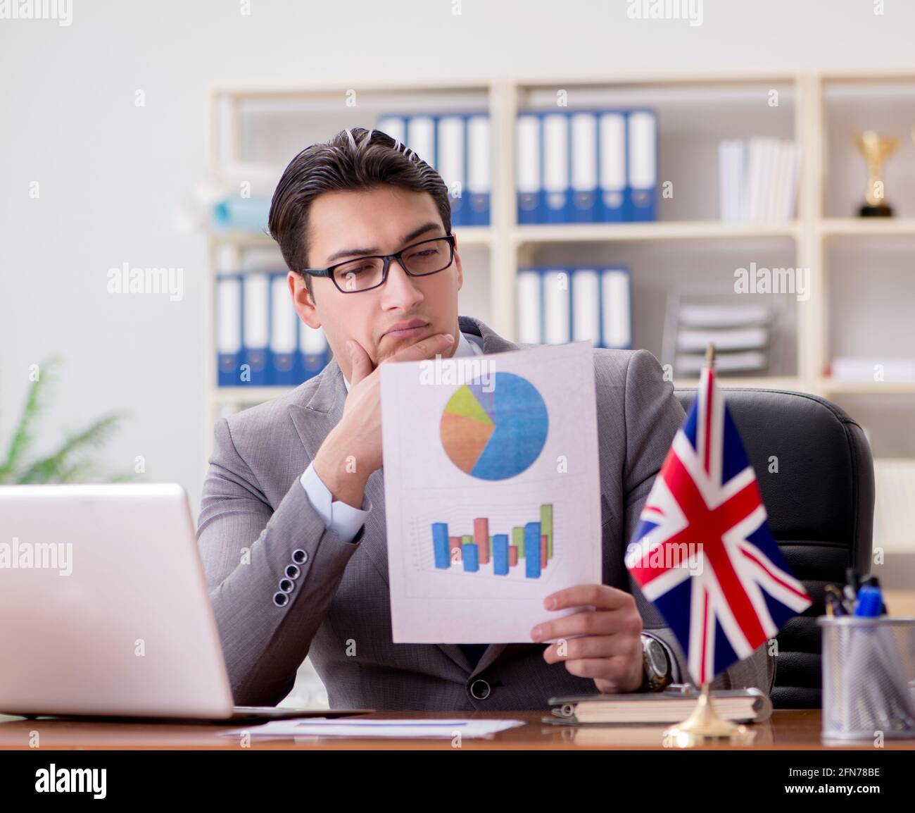 The businessman with british flag in the office Stock Photo - Alamy