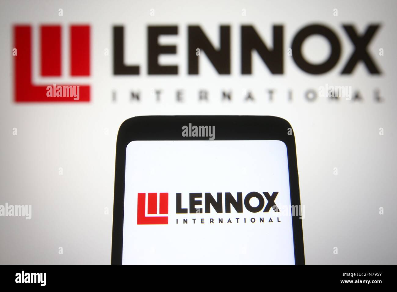 In this photo illustration the Lennox International logo is seen on a ...